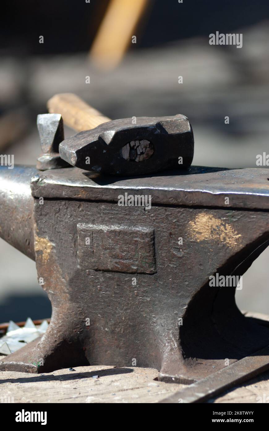 Blacksmith's hammer on a metal anvil in the forge with tools Stock ...