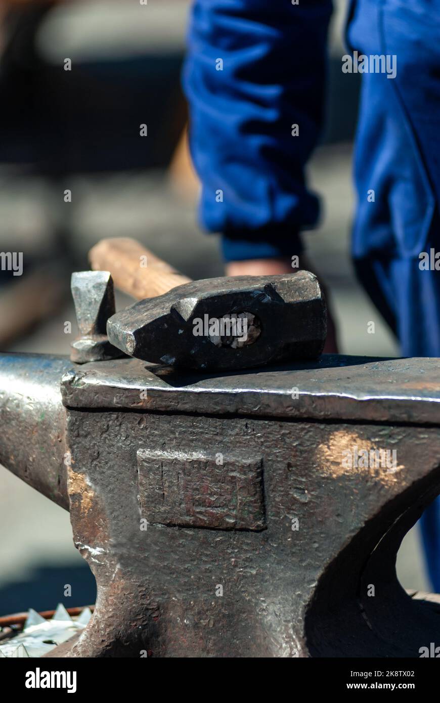 Blacksmith's hammer on a metal anvil in the forge with tools Stock ...