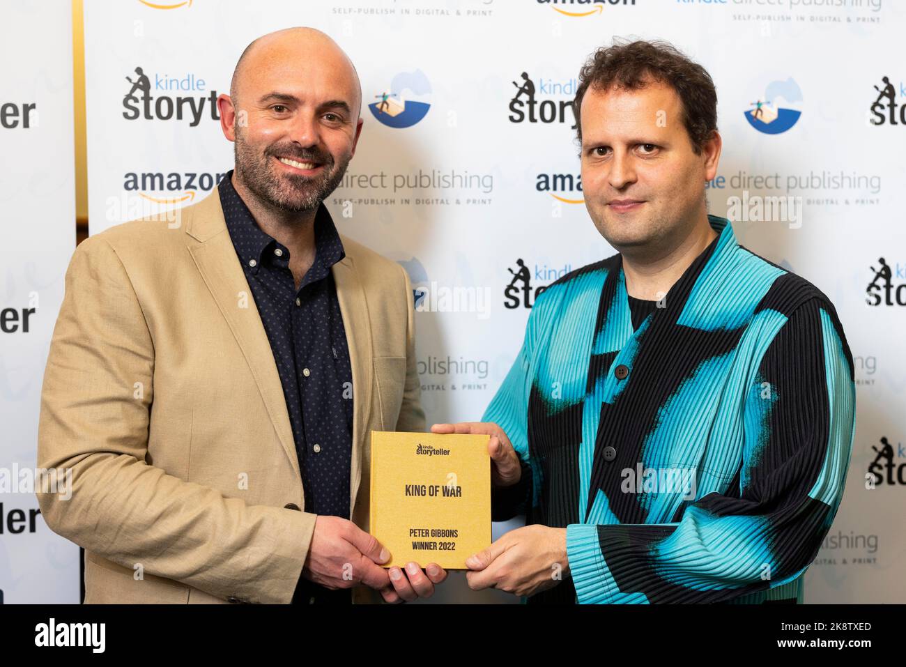 EDITORIAL USE ONLY Peter Gibbons, (left), winner of the Kindle ...