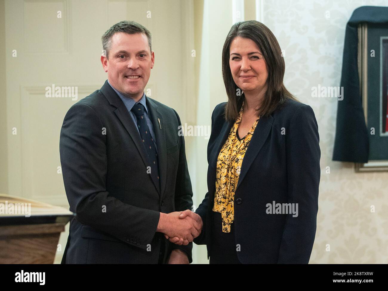 Nate Horner shakes hands with Alberta Premier Danielle Smith after ...