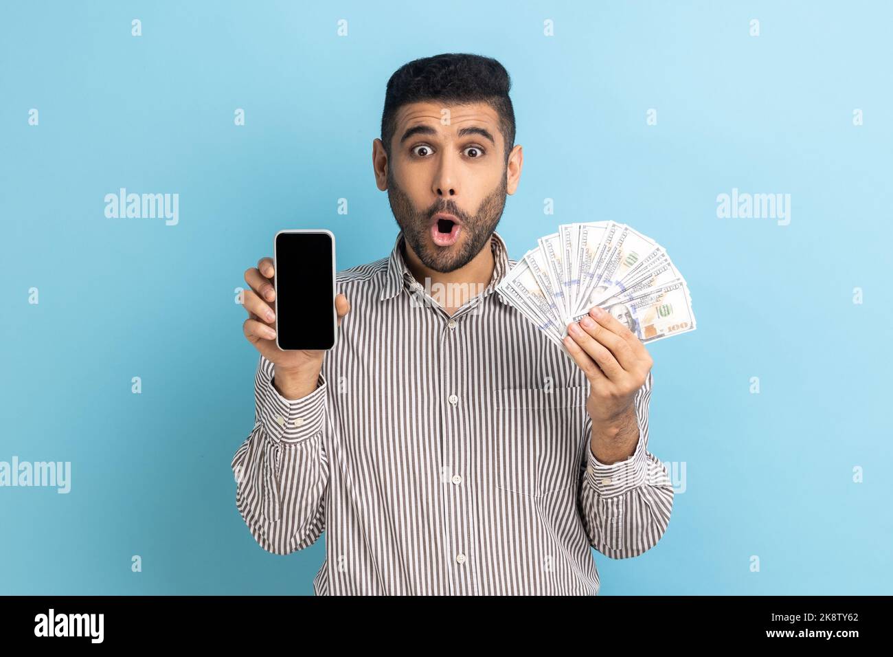 Online Payment Astonished Surprised Man With Beard Holding Cell Phone