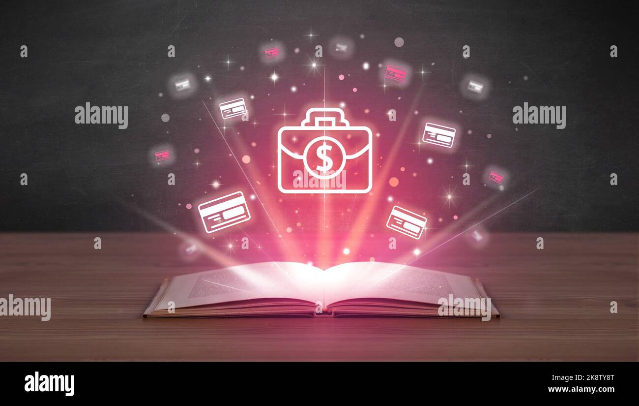 Open book with currency icons above Stock Photo - Alamy