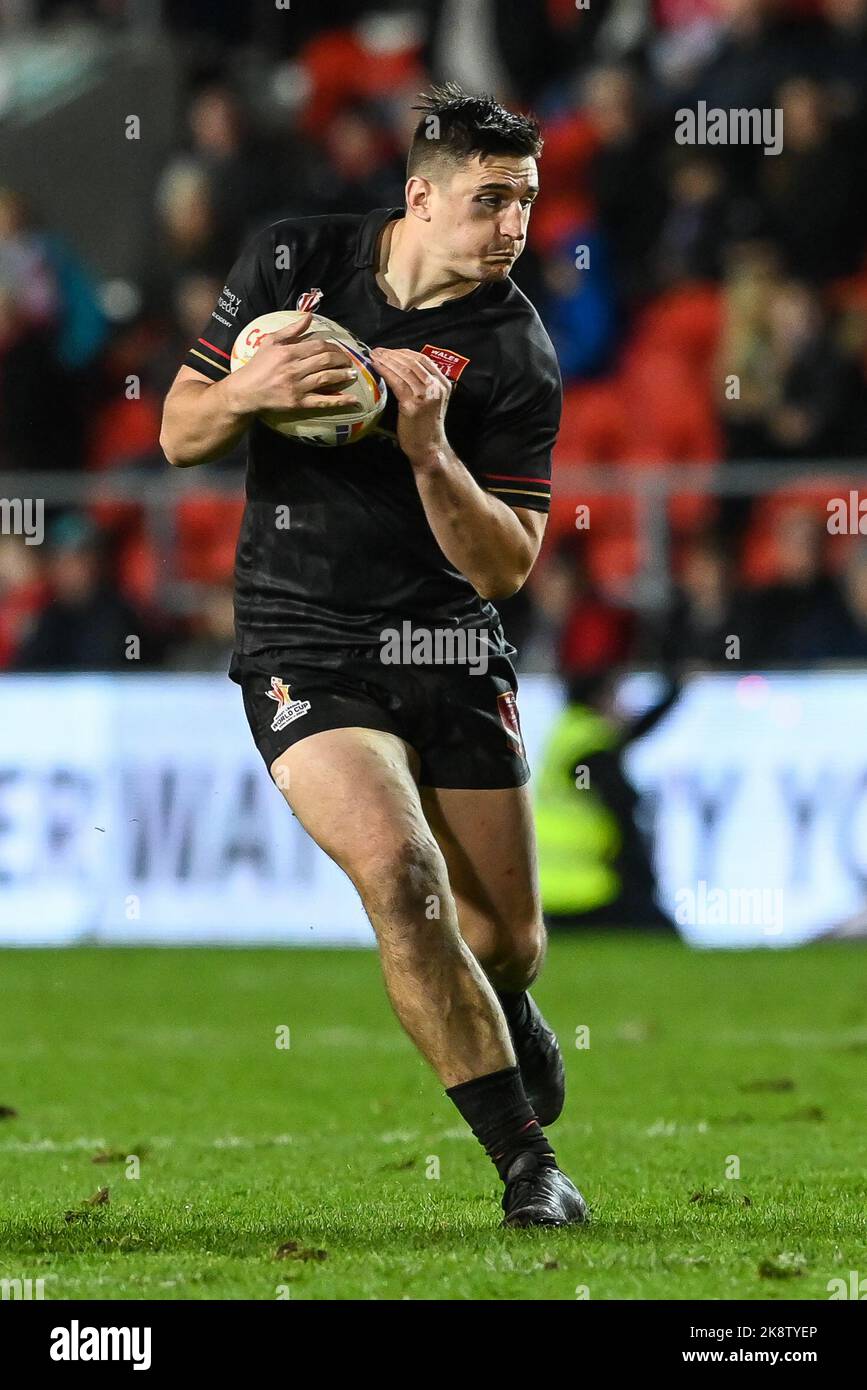 Joe Burke of Wales makes a break during the Rugby League World Cup 2021 ...