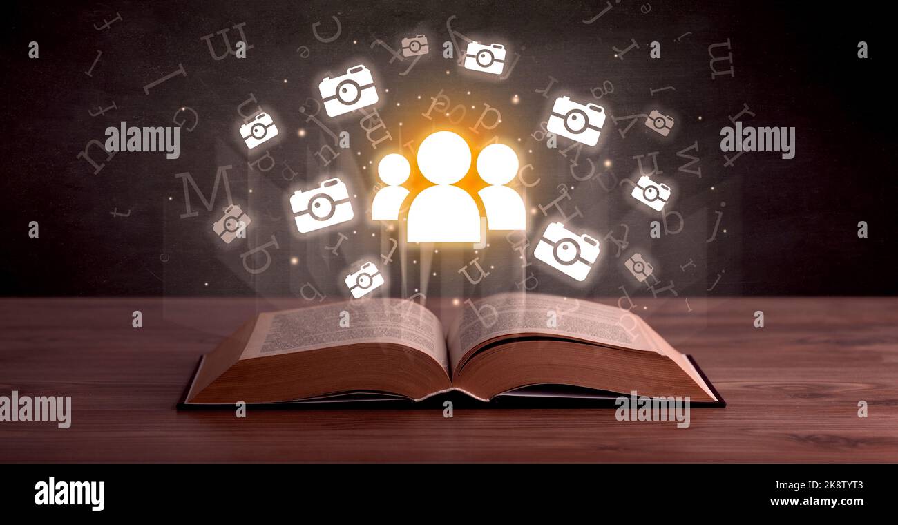 Open book with social networking icons above Stock Photo - Alamy