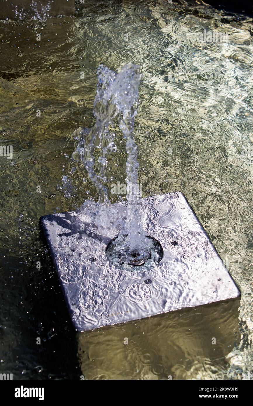 The fountains gushing sparkling water in a pool in a park Stock Photo ...