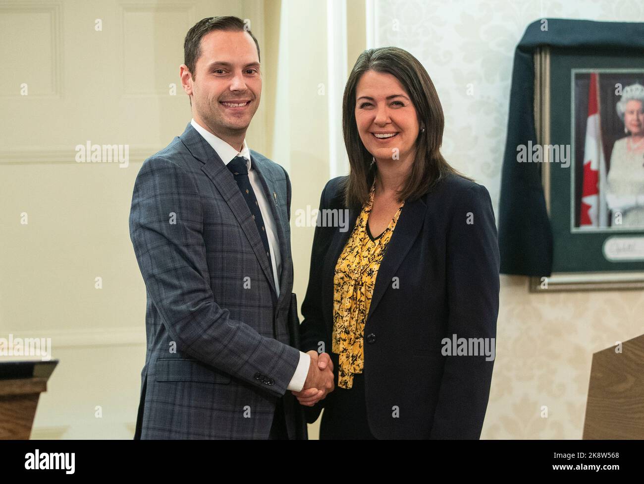 Matt Jones shakes hands with Alberta Premier Danielle Smith after Jones ...