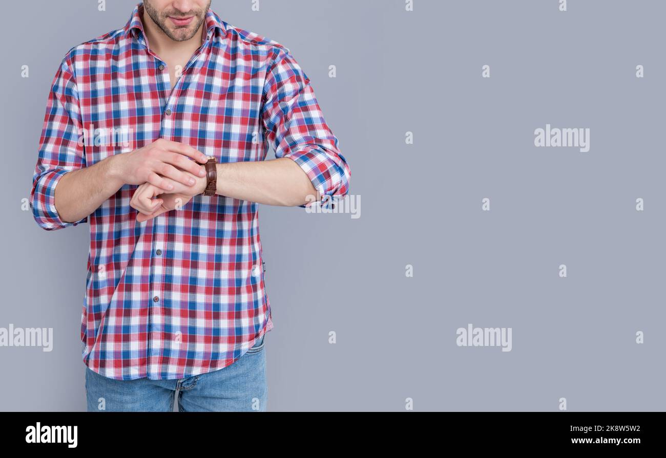 cropped view of man check time on watch. studio shot of man. man with ...
