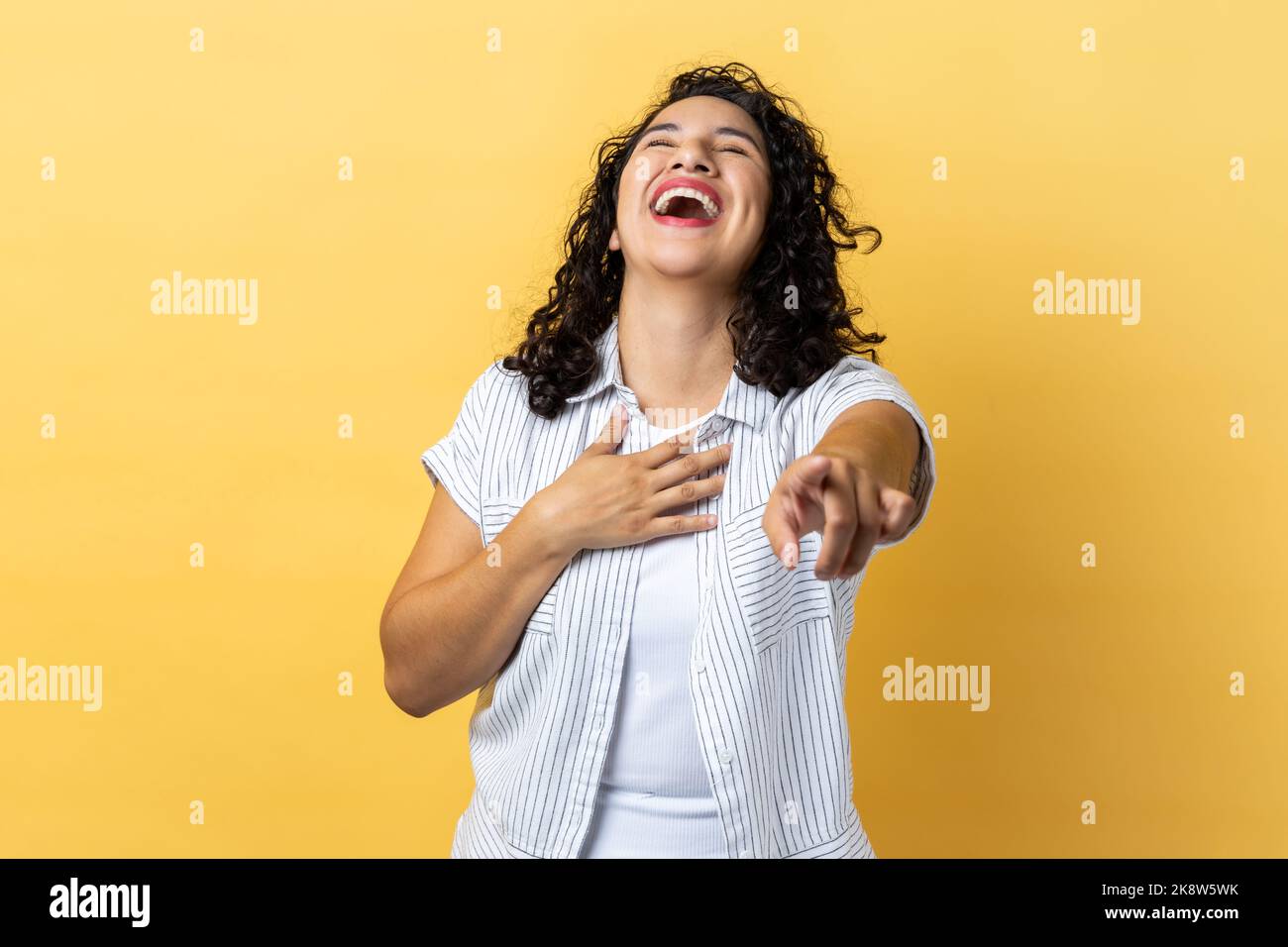 Woman pointing finger laughing hi-res stock photography and images - Alamy