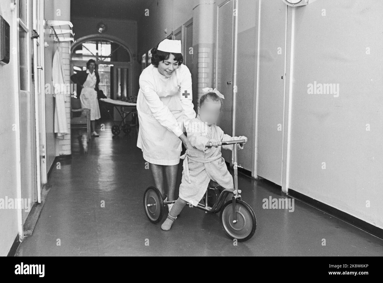 Oslo 1964 Sophies Minde. Nurse with children on a bicycle. Photo; Ivar ...