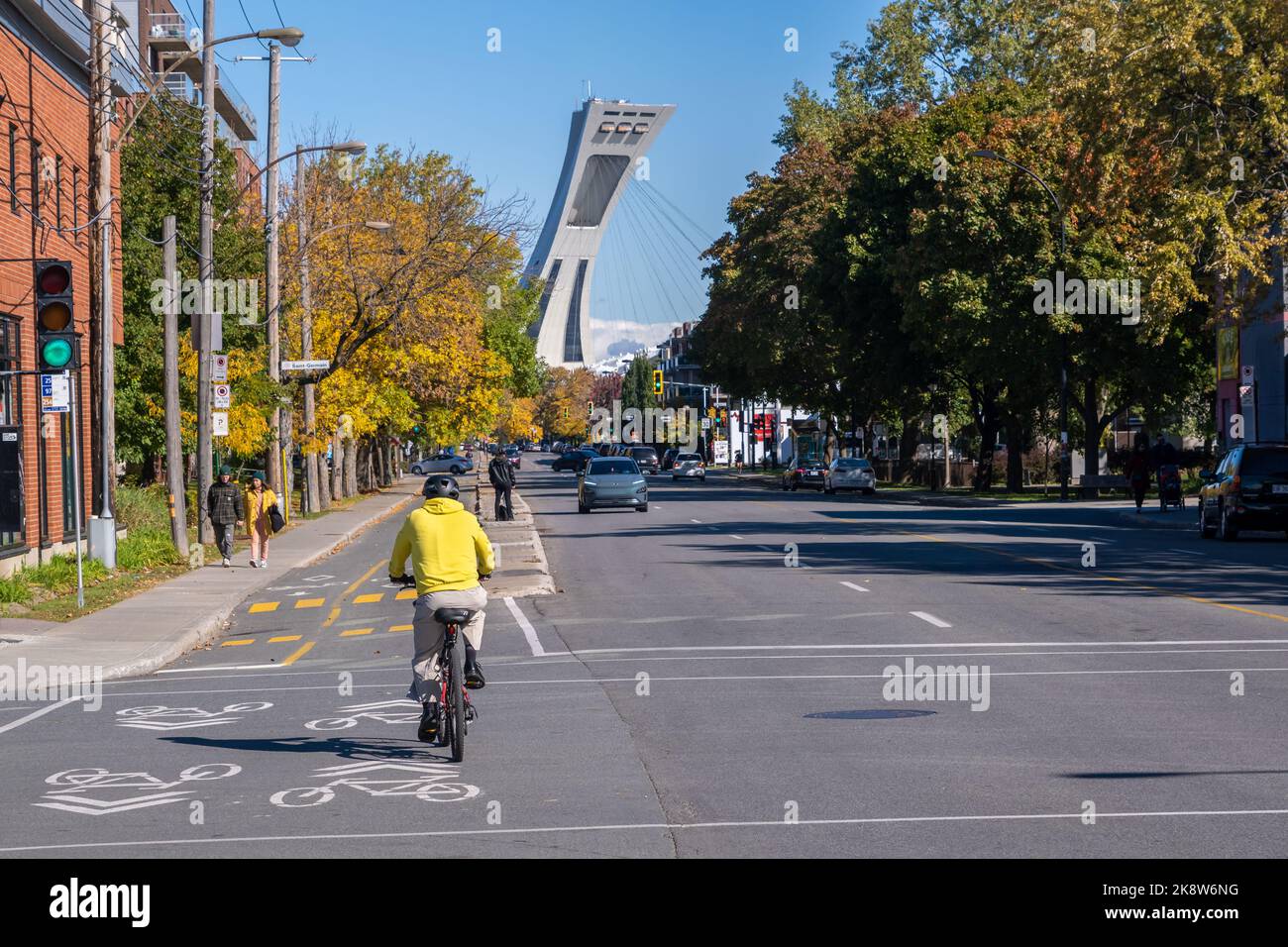 Montreal, CA - 10 October 2022: Man riding a bike on Rachel street in ...