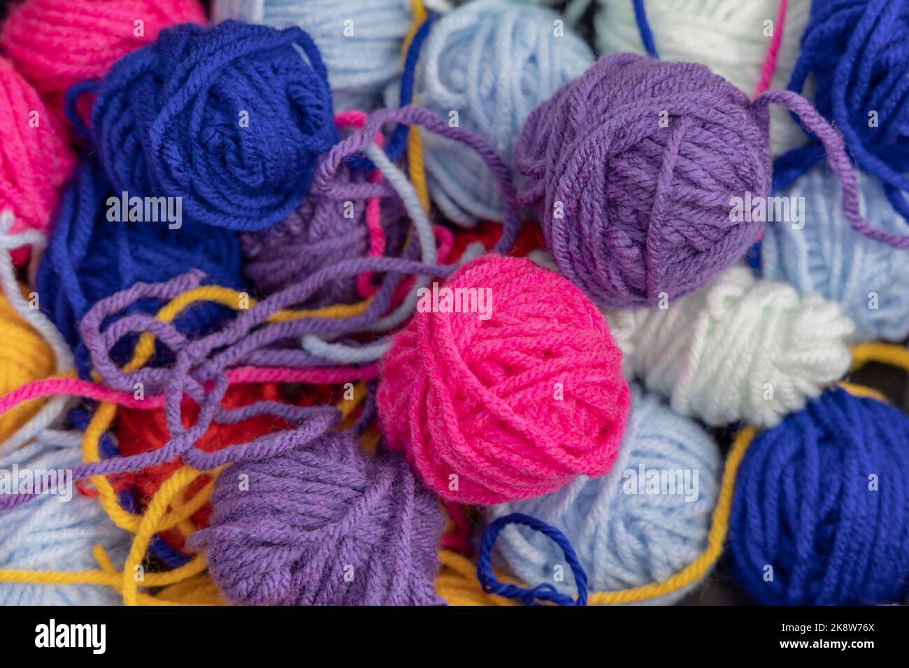 Background of colorful balls of wool Stock Photo - Alamy