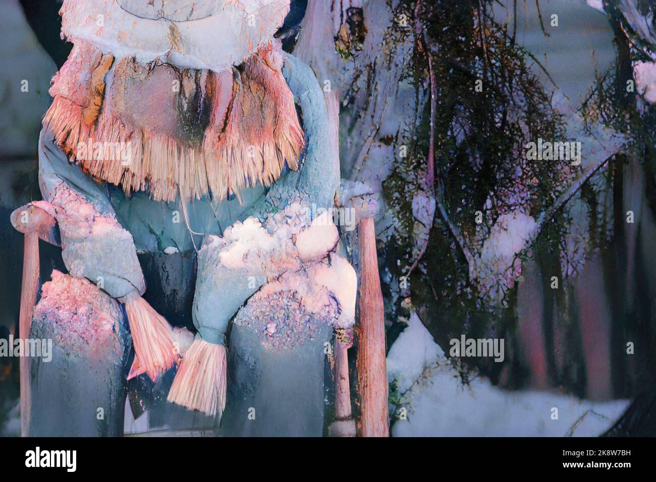 Halloween decoration scarecrow gnome covered in snow and ice sitting in ...