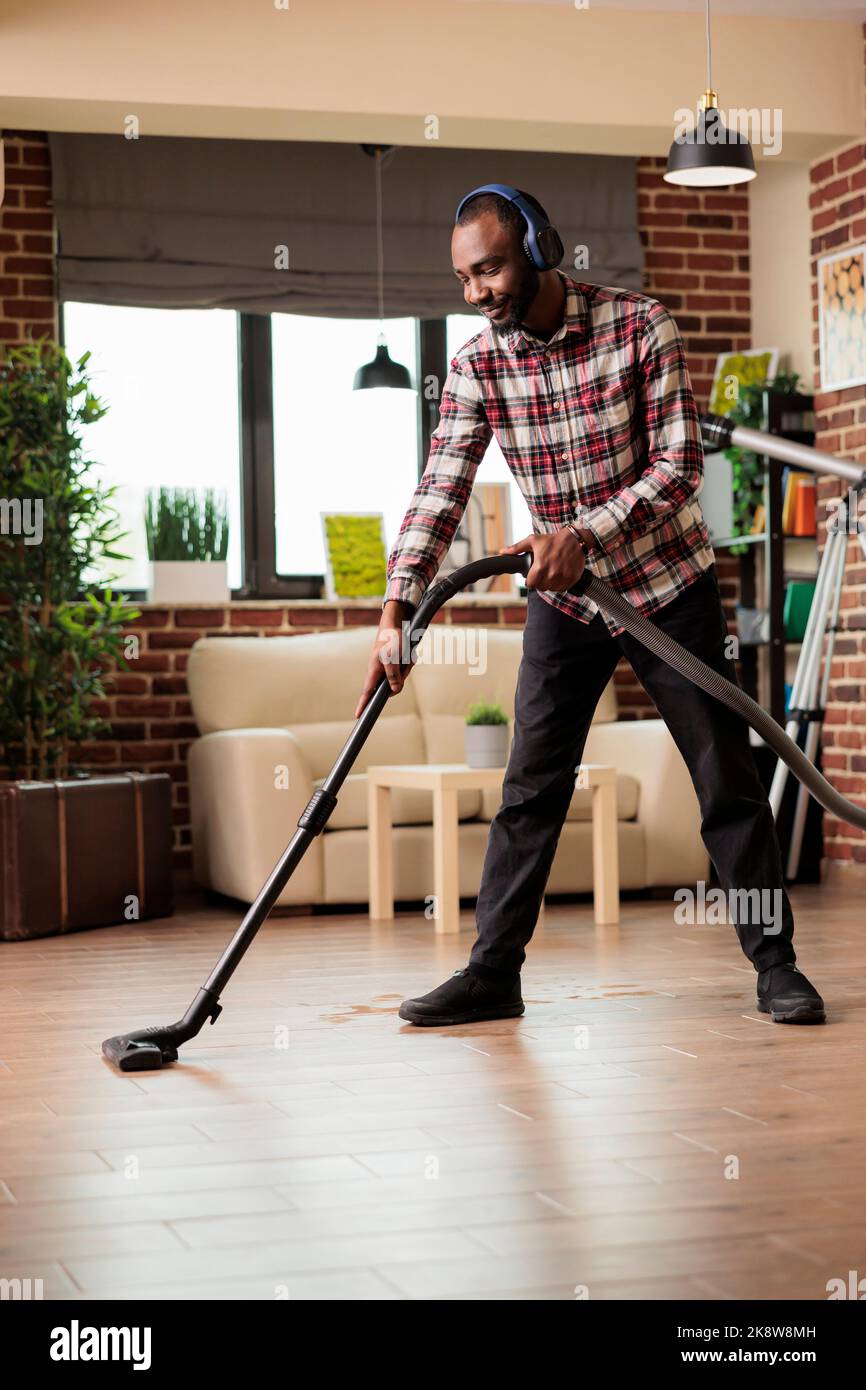 African american man vacuum hi-res stock photography and images - Alamy
