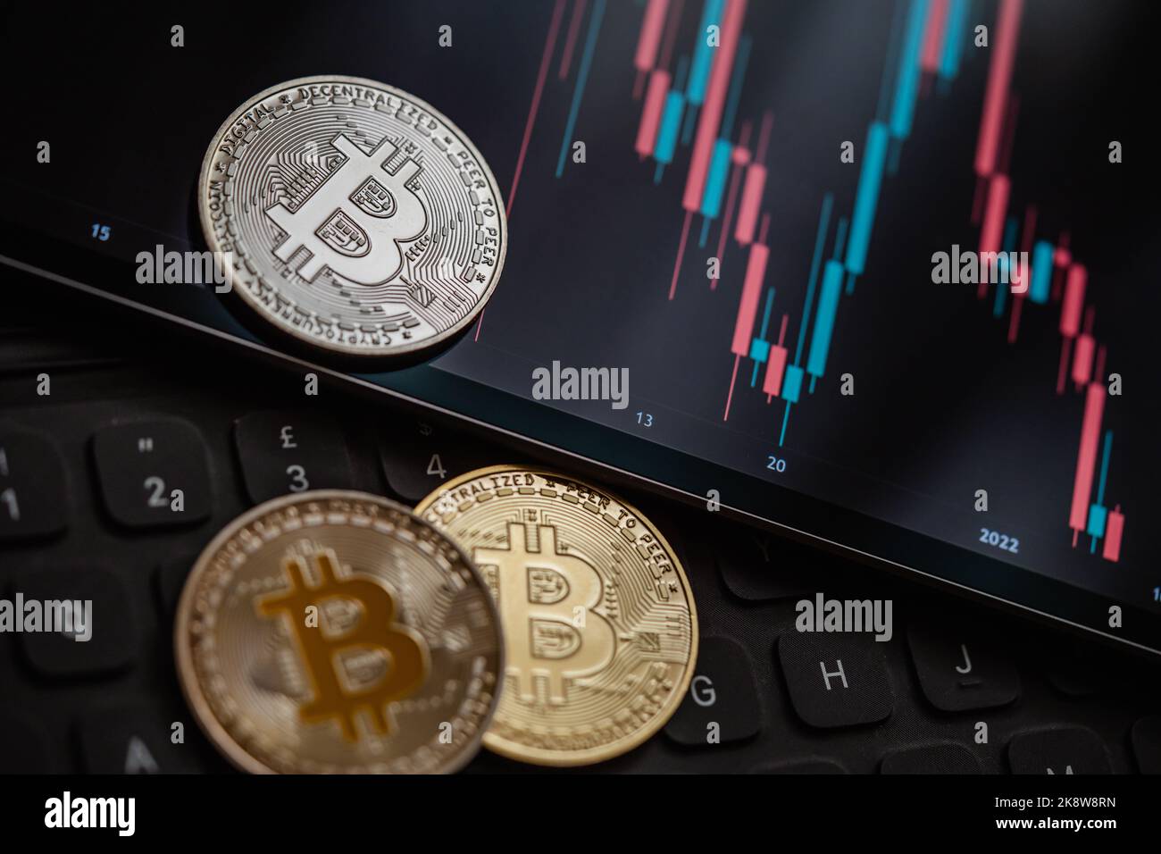 Various Bitcoin cryptocurrency coins with candle stick graph chart ...