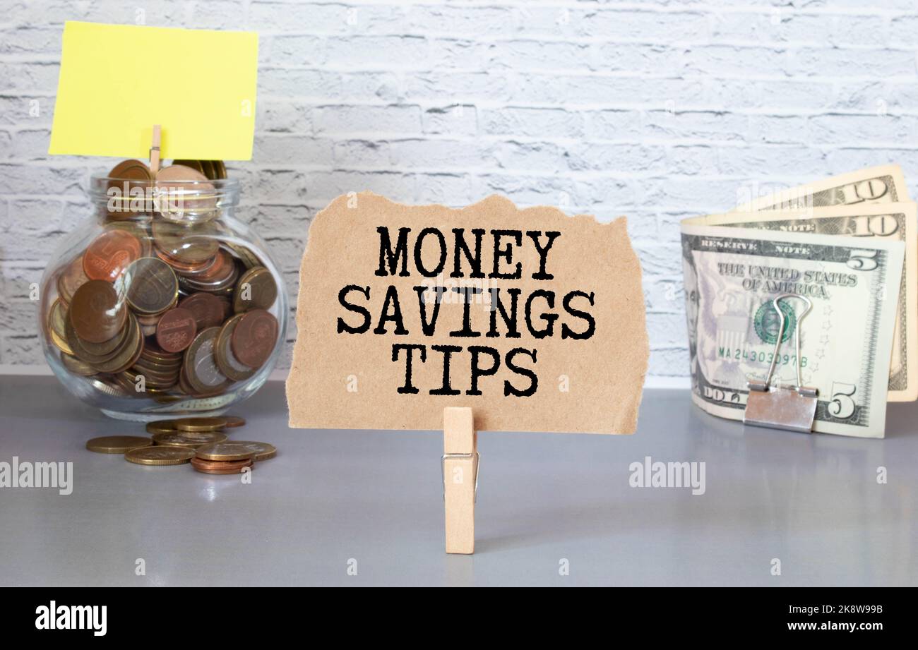 Money Savings Tips, text on small notepad with pen and calculator Stock ...