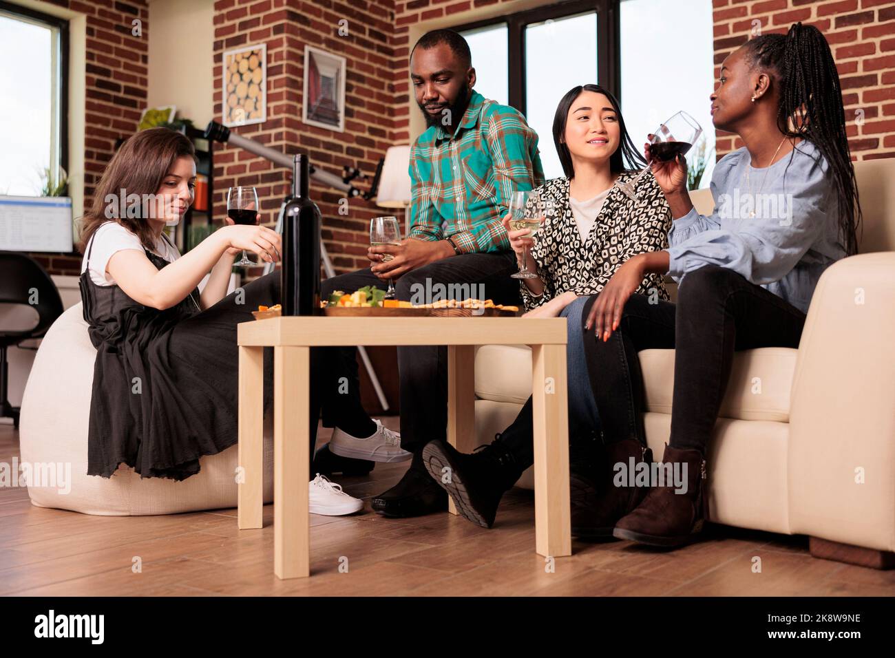 Different ethnicities couples drinking wine, alcohol, sitting at ...