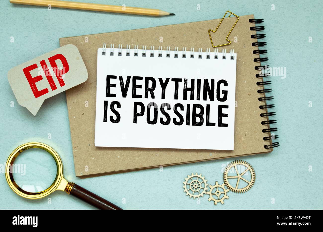 Everything is possible is written on small notepad with a cup of tea ...