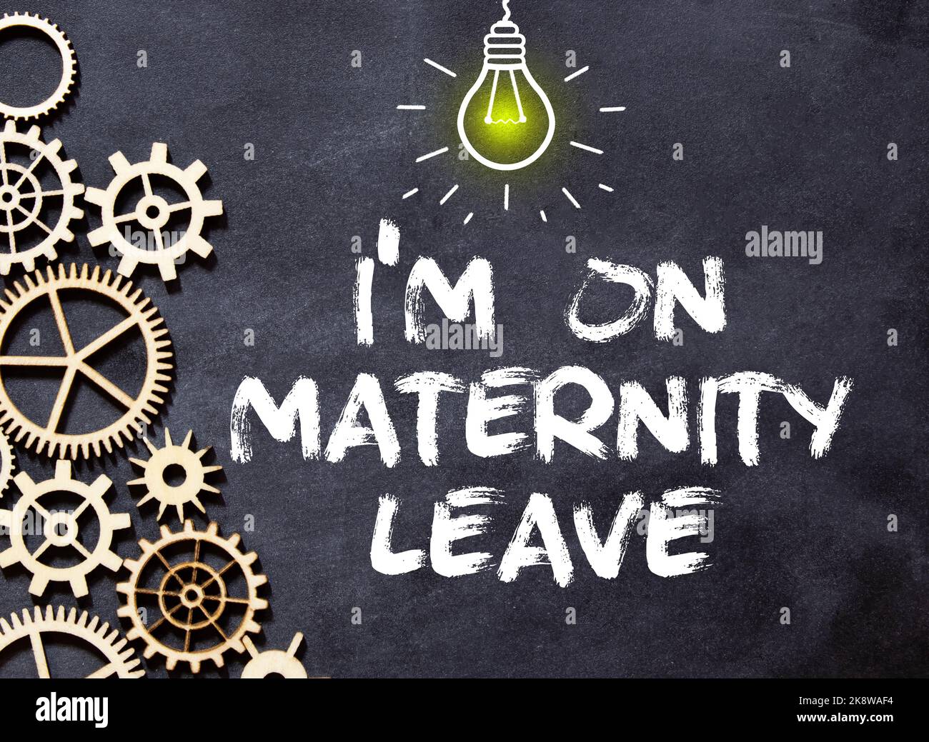 Recycled paper note pinned on cork board.I'm on Maternity Leave Message ...