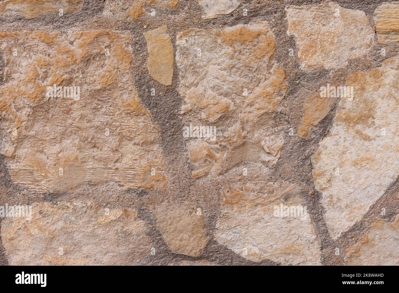 foreground in horizontal view of ancient stone wall typical of old ...