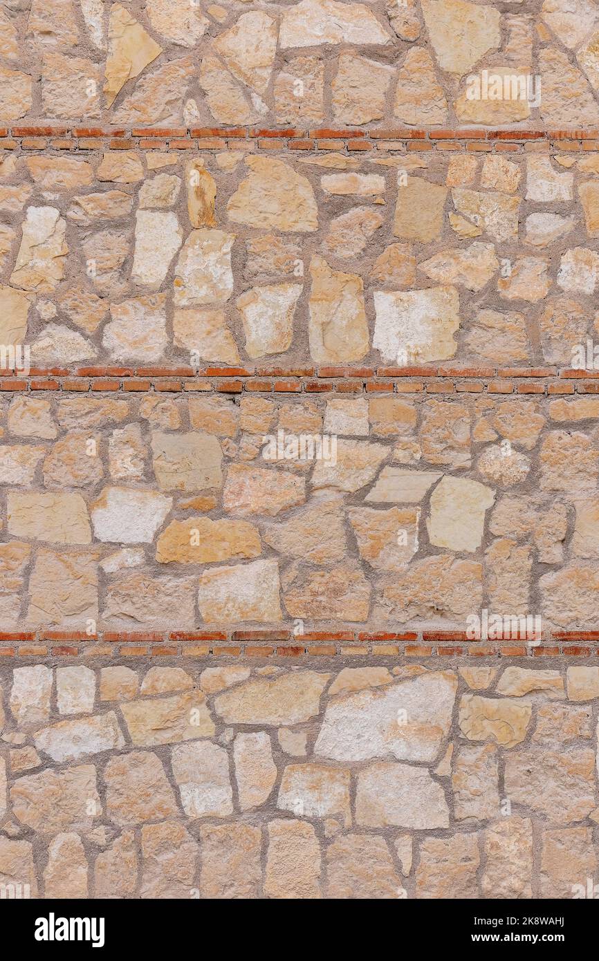 vertical view of stone wall texture background separated by three rows ...