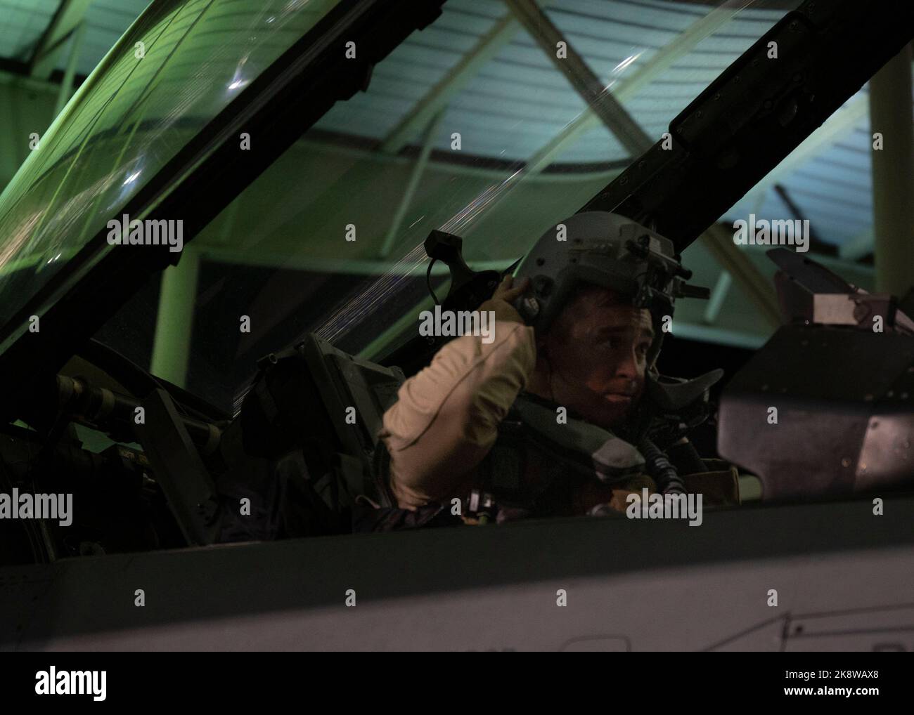 A U.S. Air Force Pilot from the 77th Fighter Squadron (77th FS) dons ...