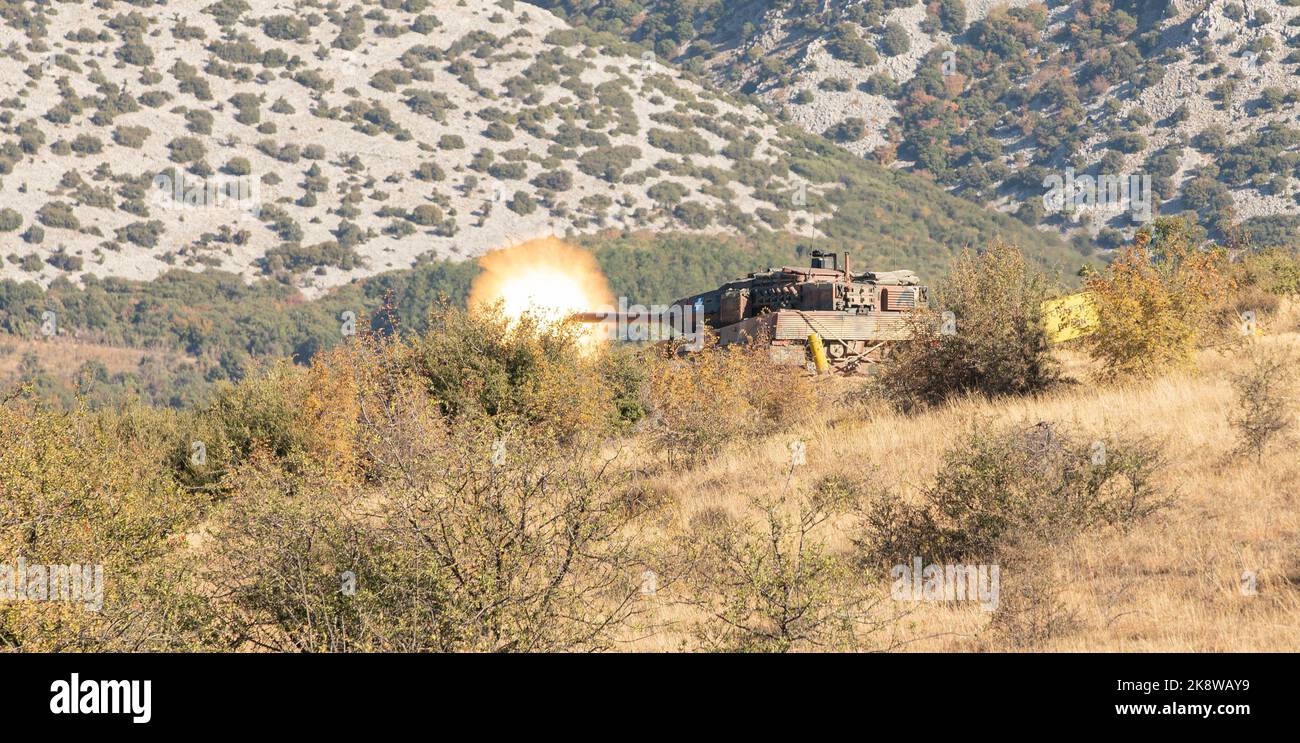 A Leo2 A6 HEL assigned to the Hellenic XXV Armored Brigade, fires at a ...