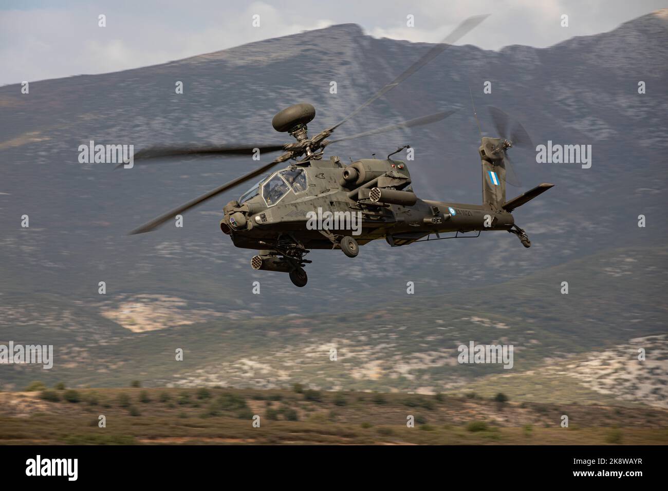 An AH-64 Apache Helicopter conducts a fly over during DV Day as part of ...