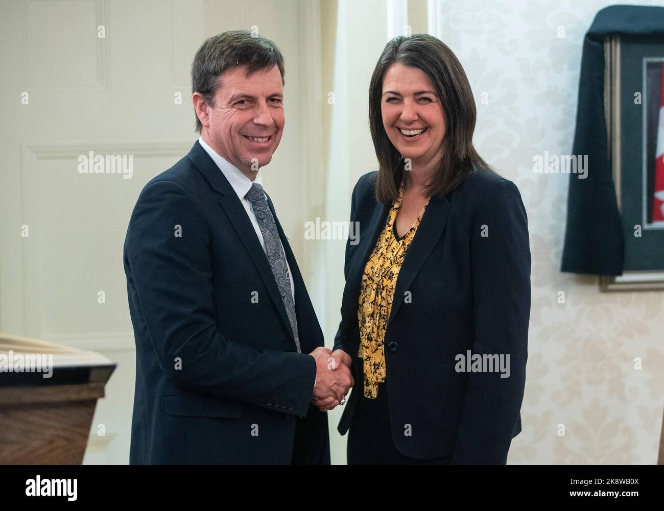 Todd Loewen shakes hands with Alberta Premier Danielle Smith after ...