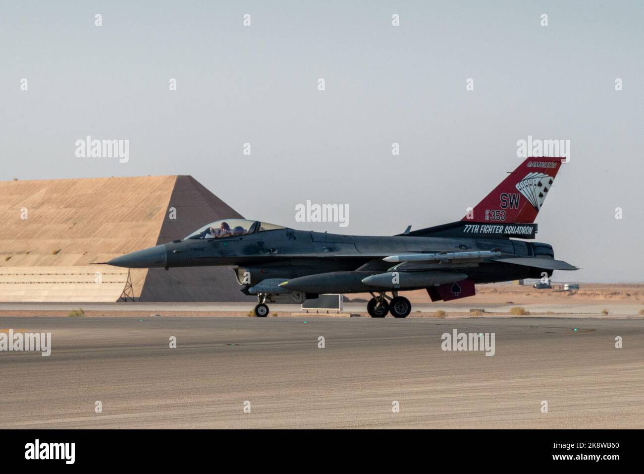 An F-16 Fighting Falcon aircraft, assigned to the 77th Fighter Squadron ...