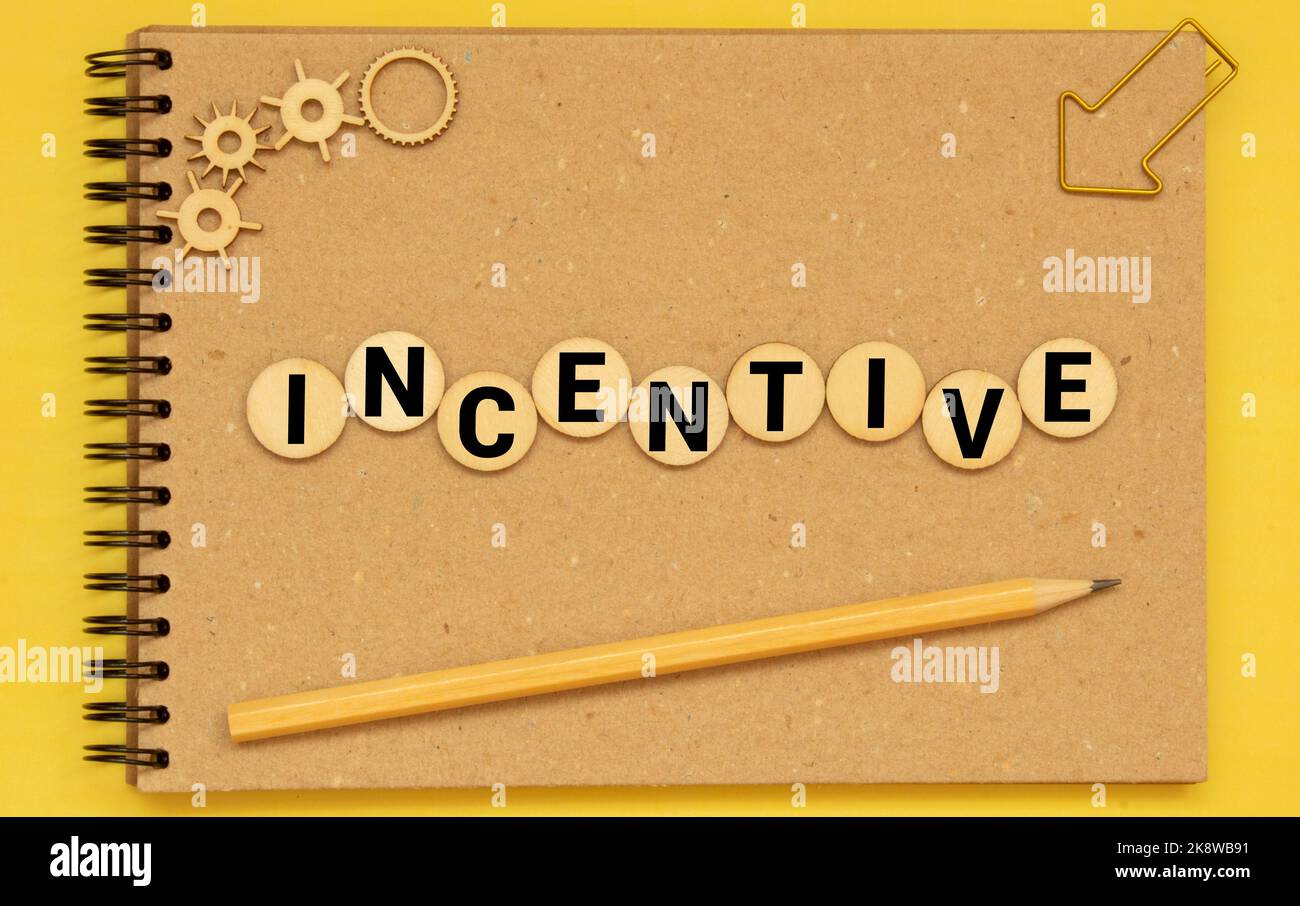 Incentive Word Written In Wooden Cube Stock Photo - Alamy