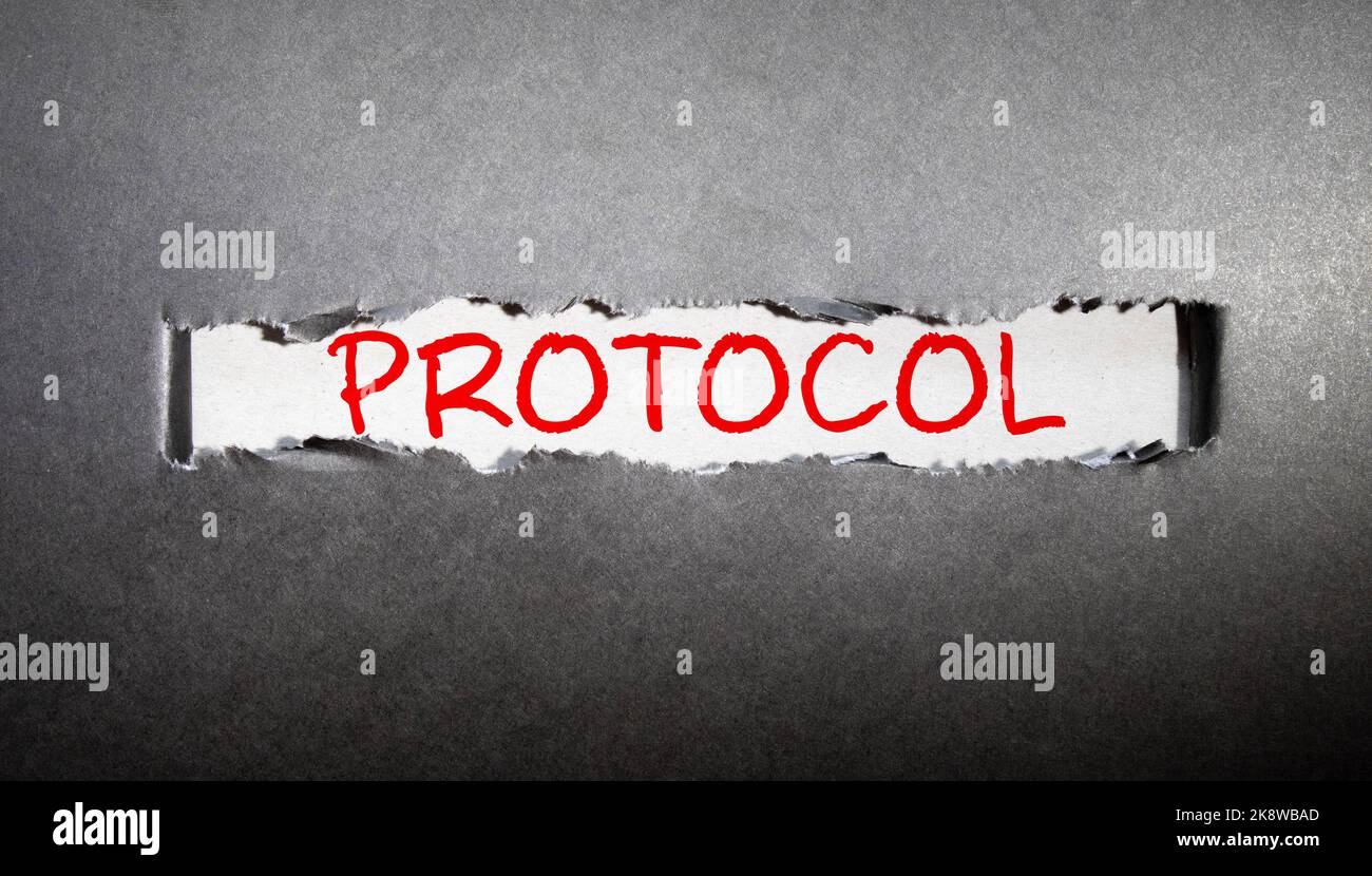 PROTOCOL word written on wood block. PROTOCOL text on wooden table for ...