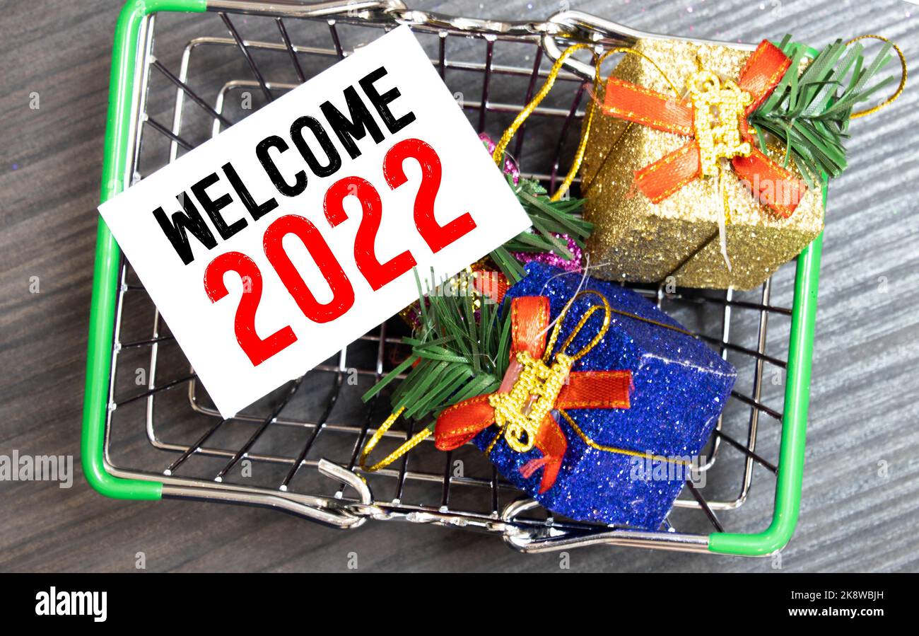 Welcome 2022 creative flat lay composition with office accessories on ...