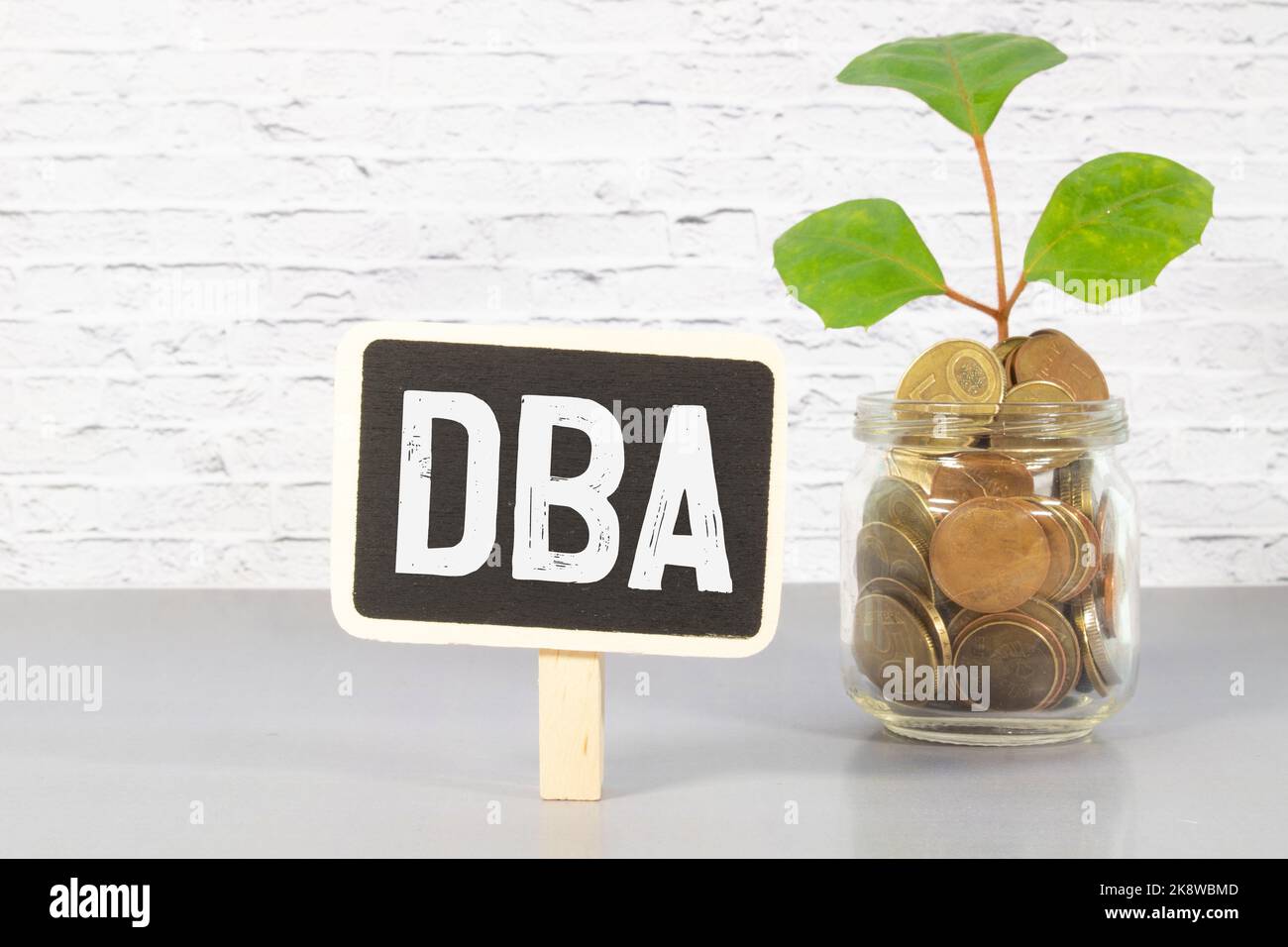DBA message on the card shown by a man, vintage tone Stock Photo - Alamy