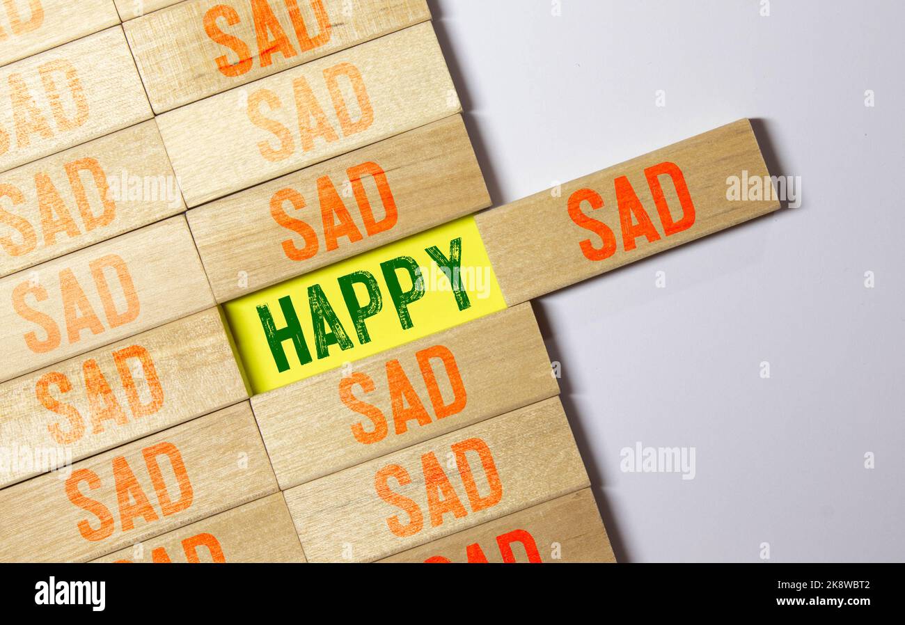 happy vs sad word written on wood block. Top view concept. Isolated on ...