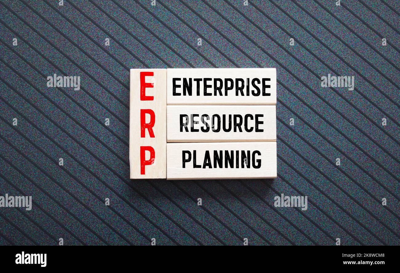 ERP Enterprise Resource Planning written on cubes on blue background ...