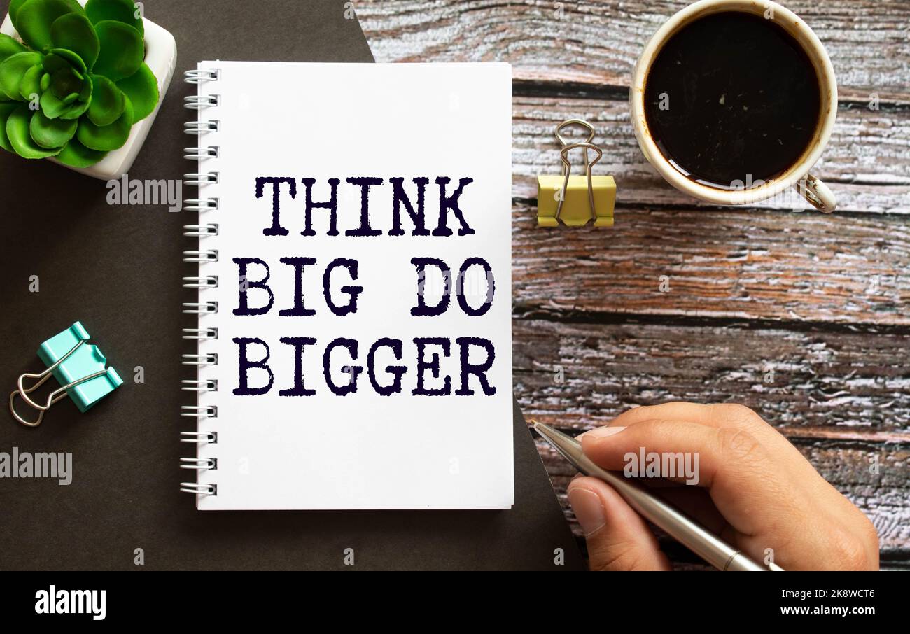 Think Big, Do Bigger Motivation quote written on a note paper Stock ...