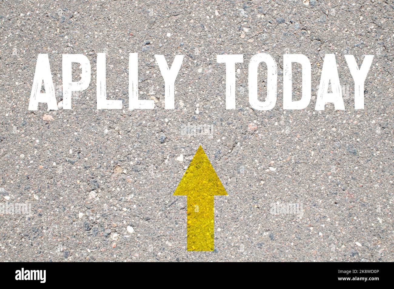 Red alarm clock and APPLY TODAY inscription written on natural sandy ...