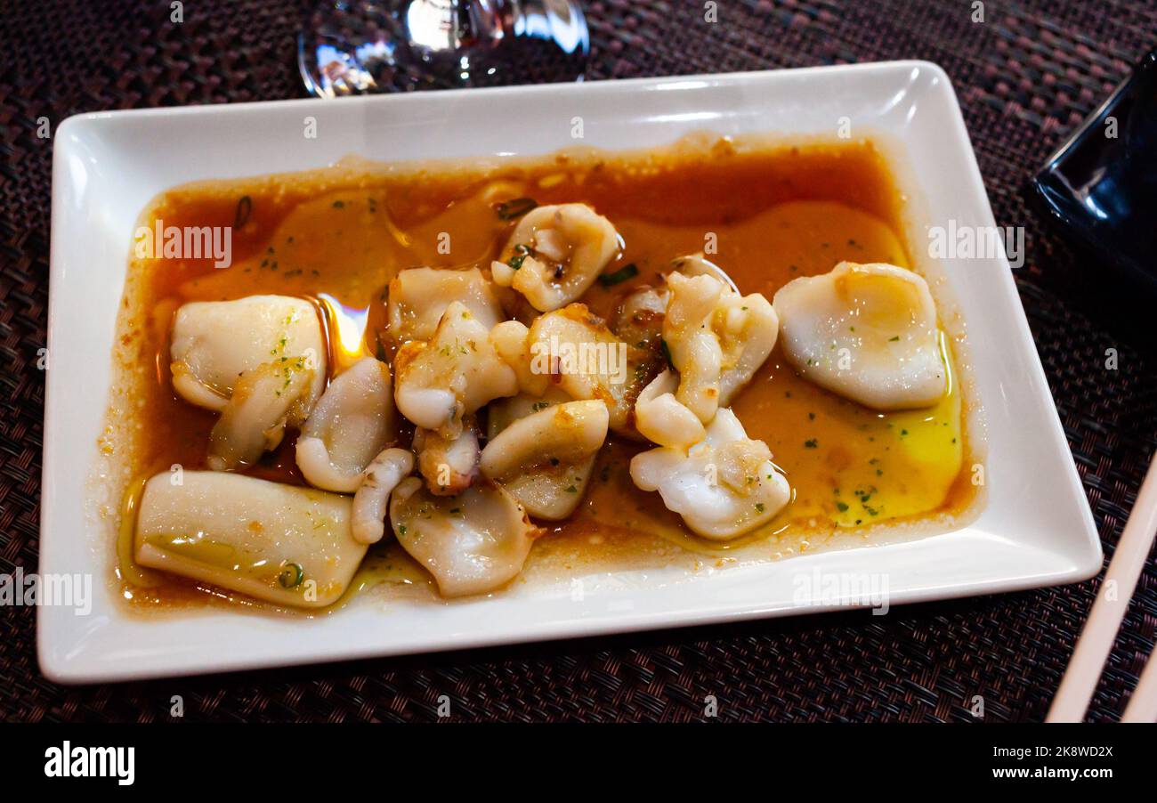 Fried cuttlefish in spicy sauce. Japanese food Stock Photo - Alamy