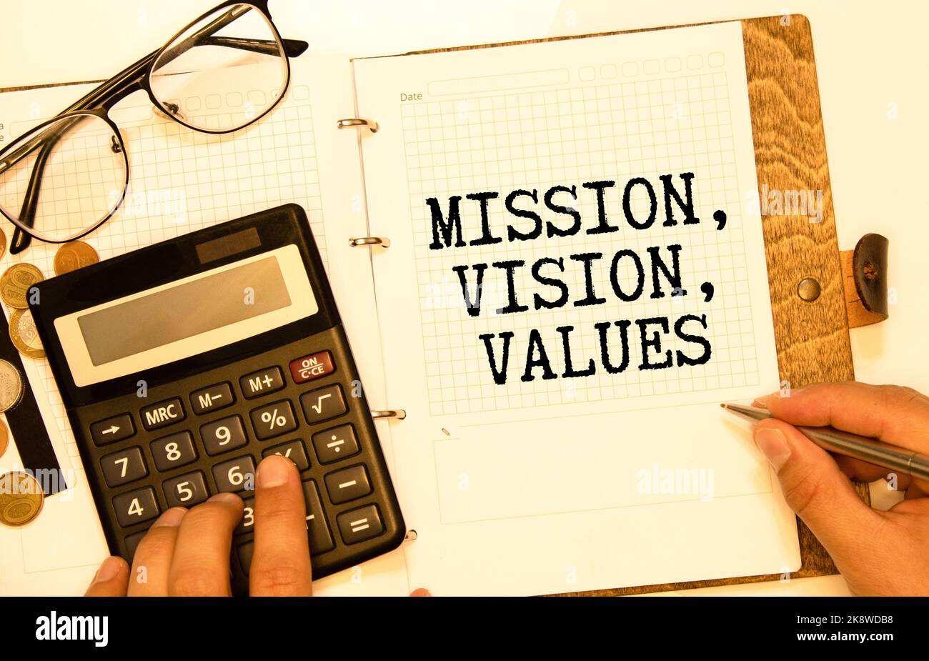 Mission Vision and Values as memo on notebook with glowing light bulb ...