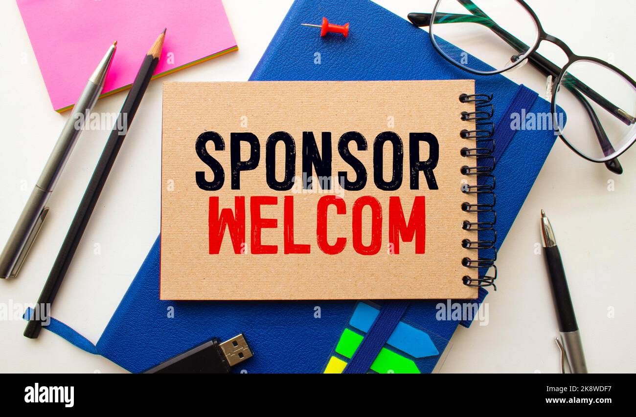 Human hand with marker writing text on notepad: Sponsors Welcome Stock ...