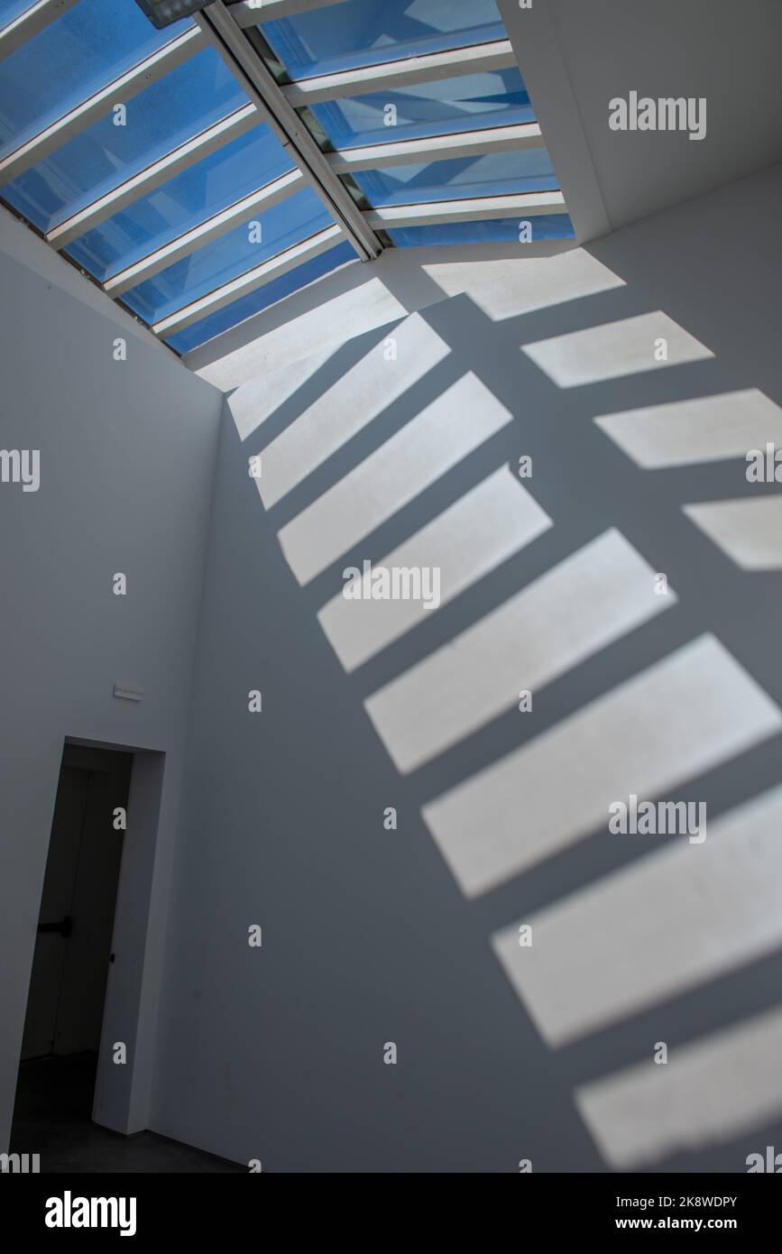 Room illuminated by the light entering through the skylight Stock Photo ...