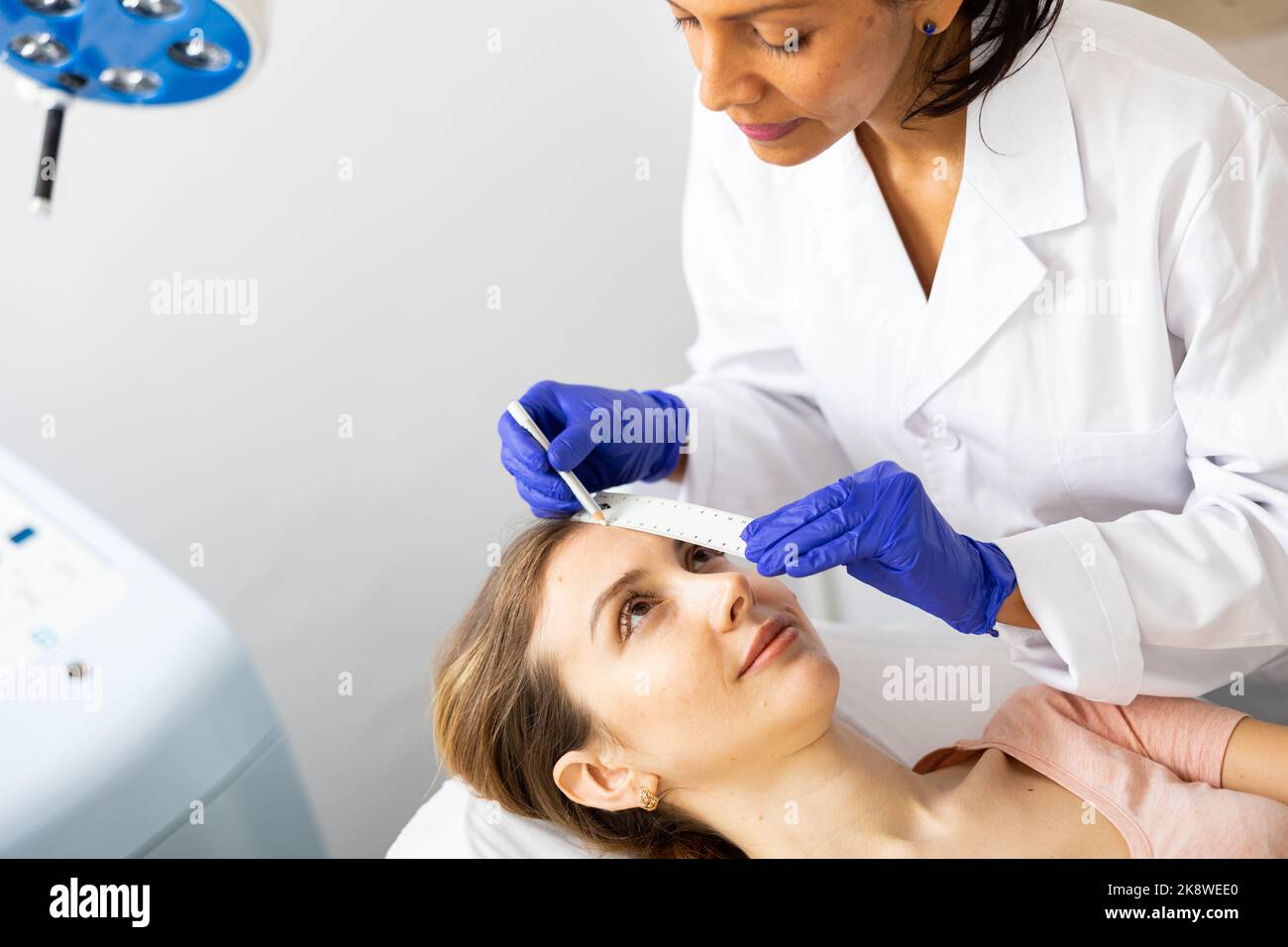 Woman ruler pencil measuring hi-res stock photography and images - Alamy