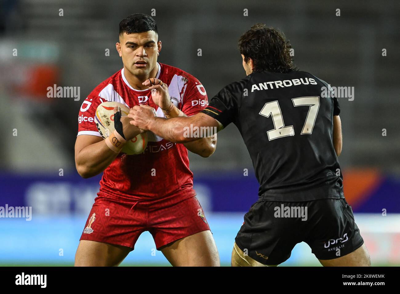 David Fifita of Tonga is tackled by Bailey Antrobus of Wales during the ...