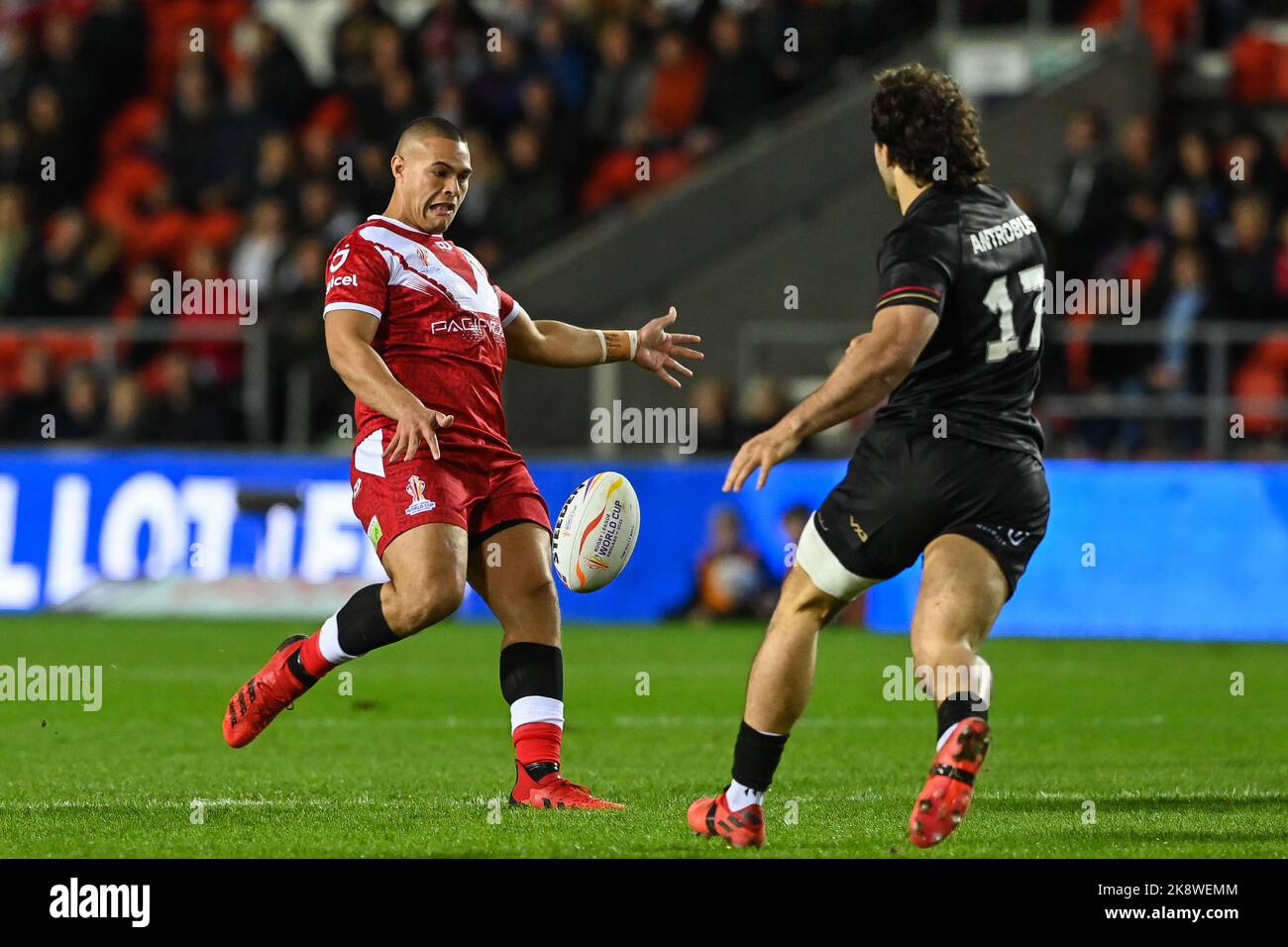 Tui Lolohea of Tonga kicks ahead during the Rugby League World Cup 2021 ...