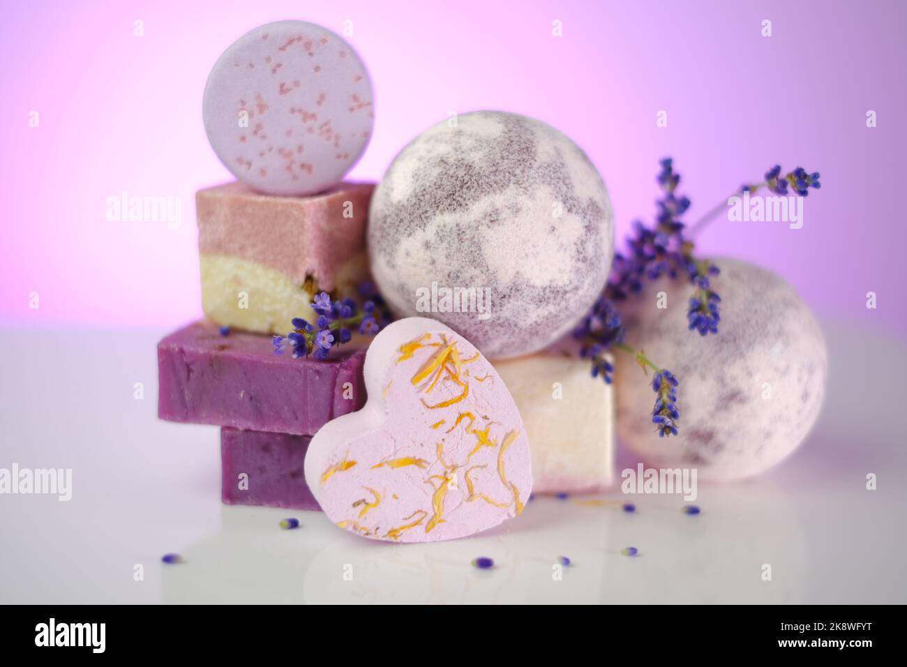Lavender soap.Bars of purple soap and lavender flowers on a light ...