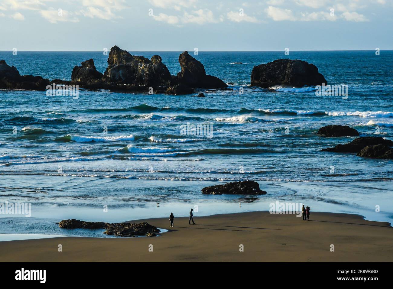People stroll along beautiful Bandon Beach in Oregon Stock Photo - Alamy