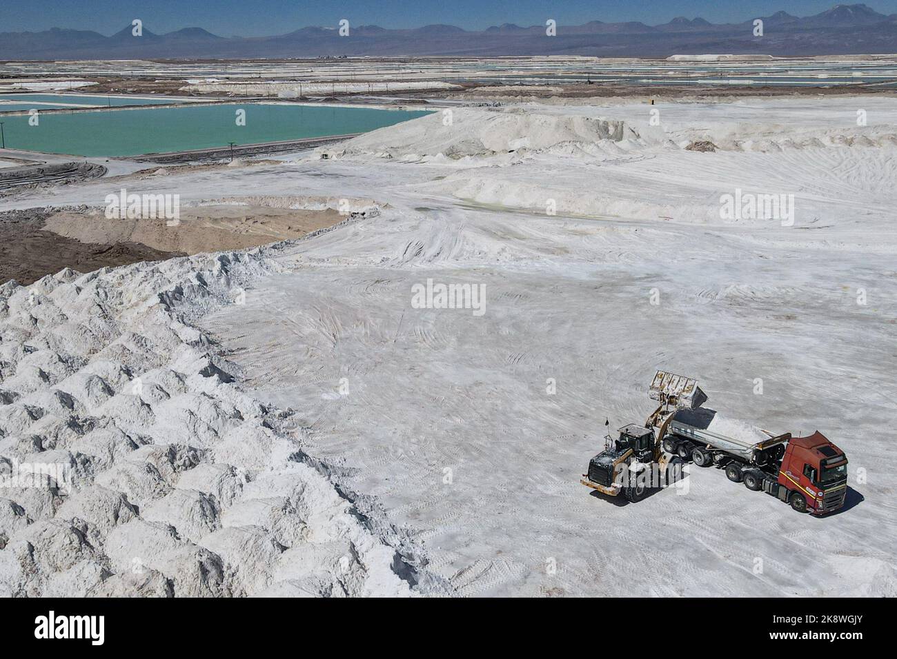 Atacama, Chile. 24th Oct, 2022. Workers at a lithium mine transport a ...