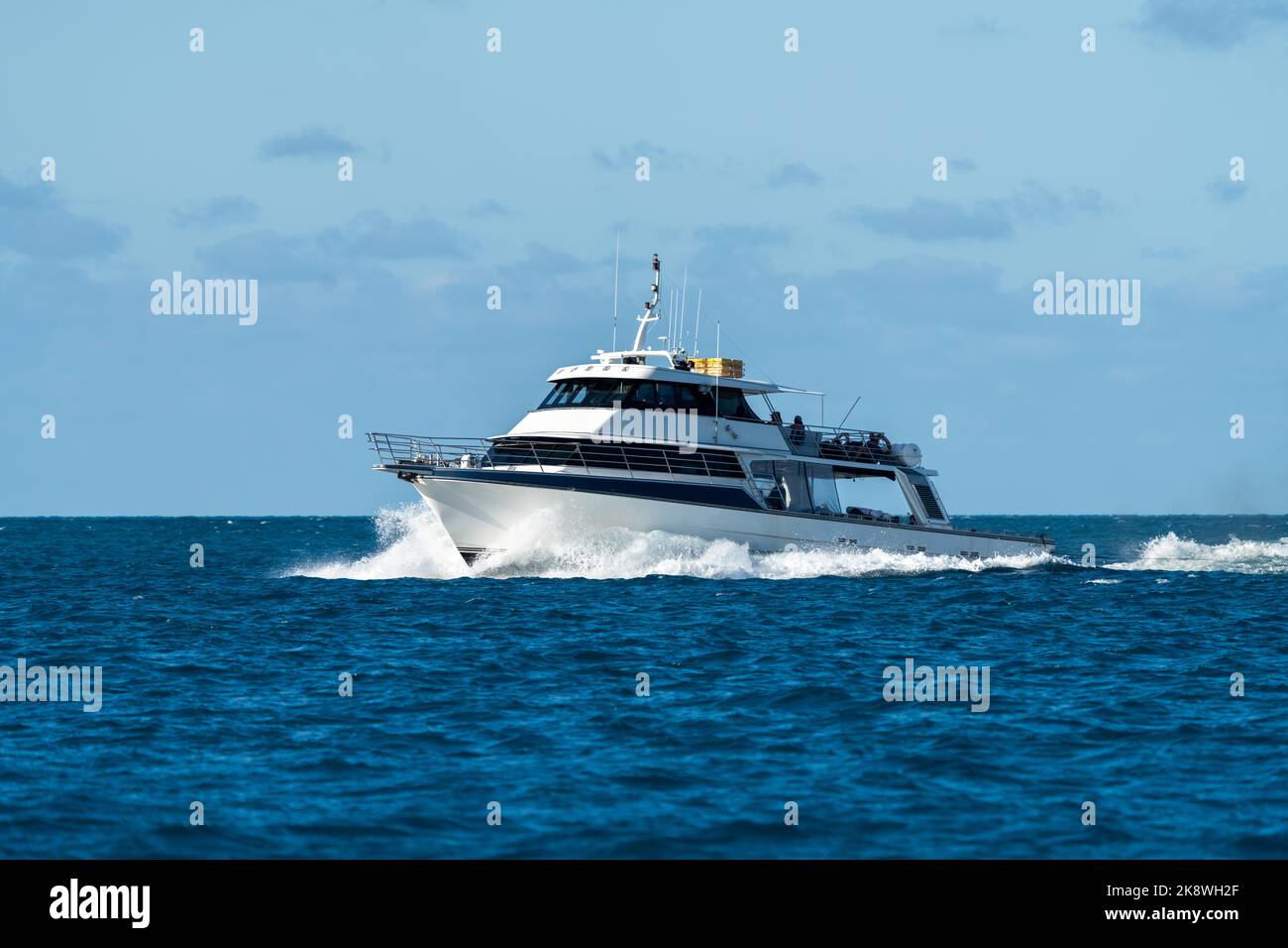Tropical island in the Great Barrier Reef. coral reef, with yachts ...
