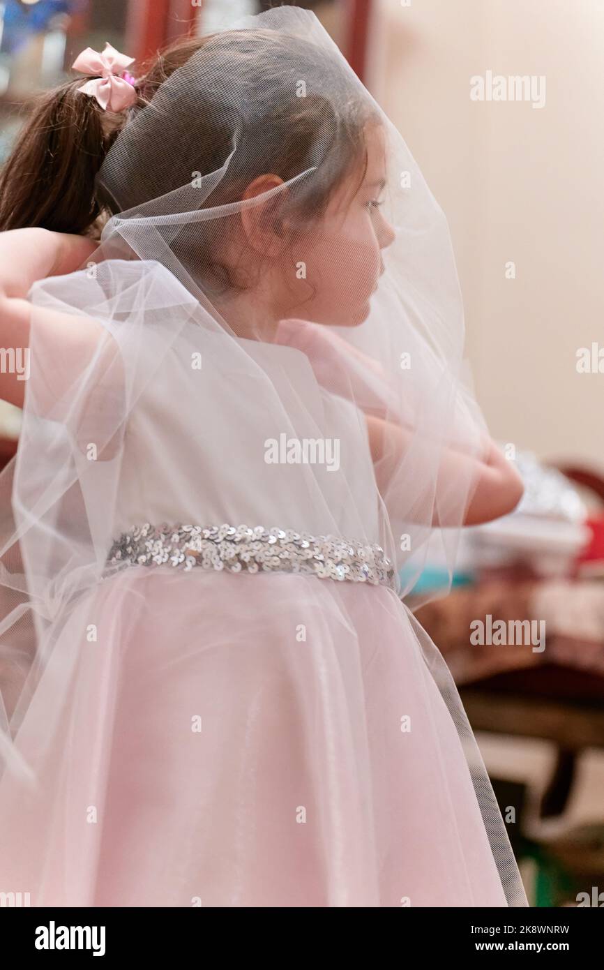 beautiful girl playing with her formal dress while trying it on Stock ...