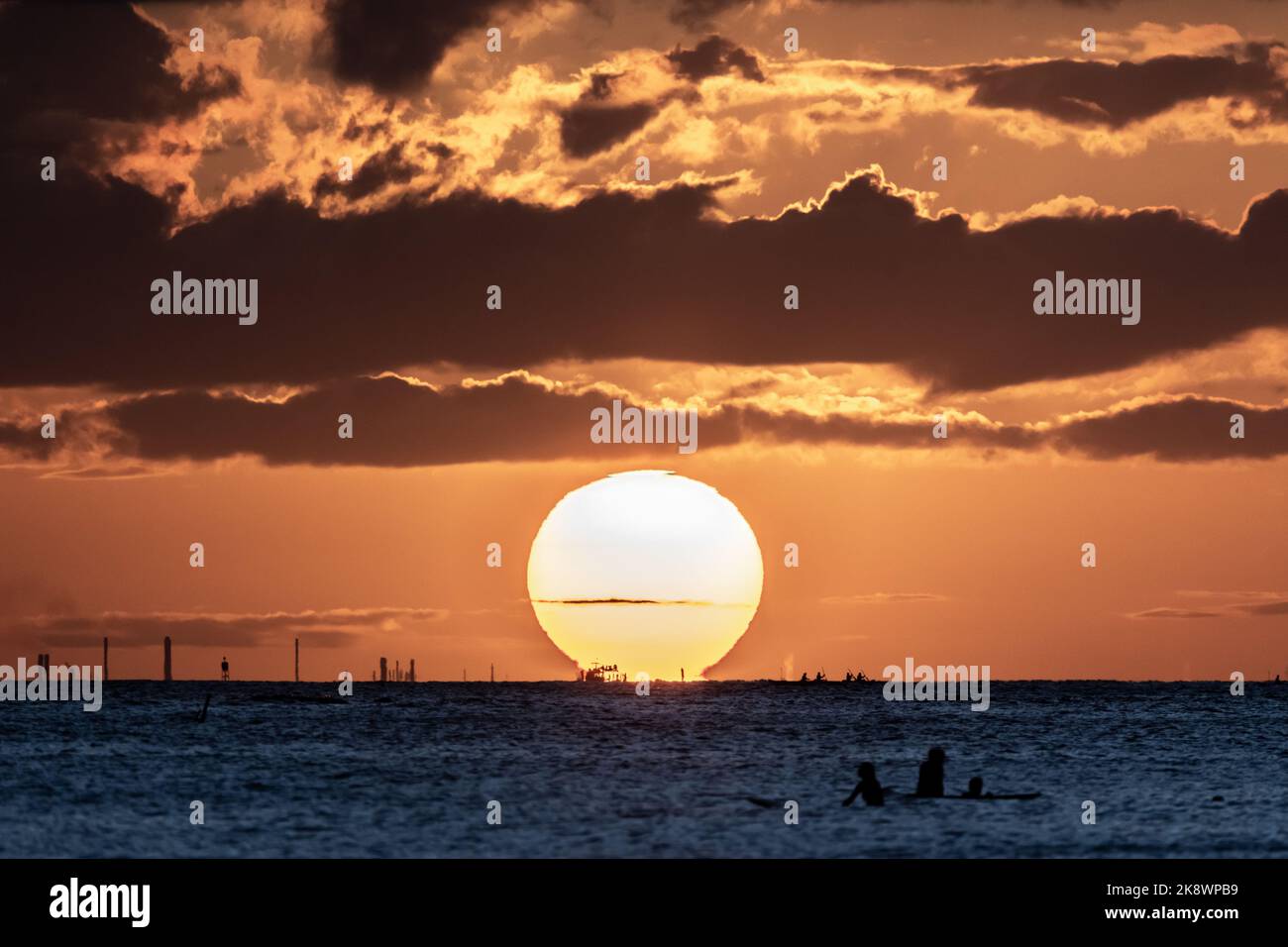 Incredible sunset on Waikiki Beach with sail boat silhouette. Sunset ...